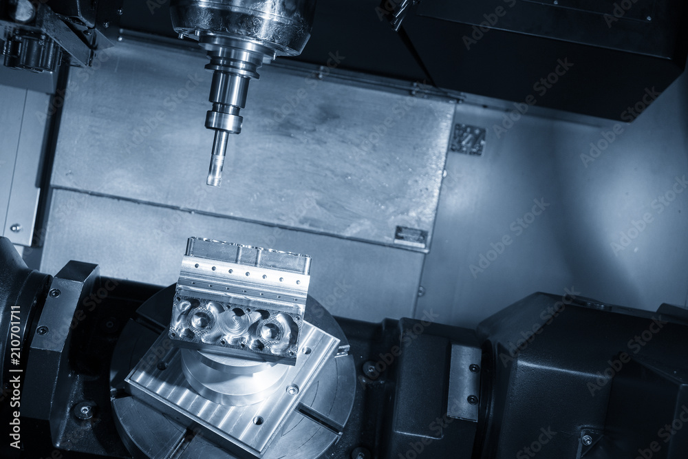 The 5-axis CNC milling machine or machining center cutting the ...