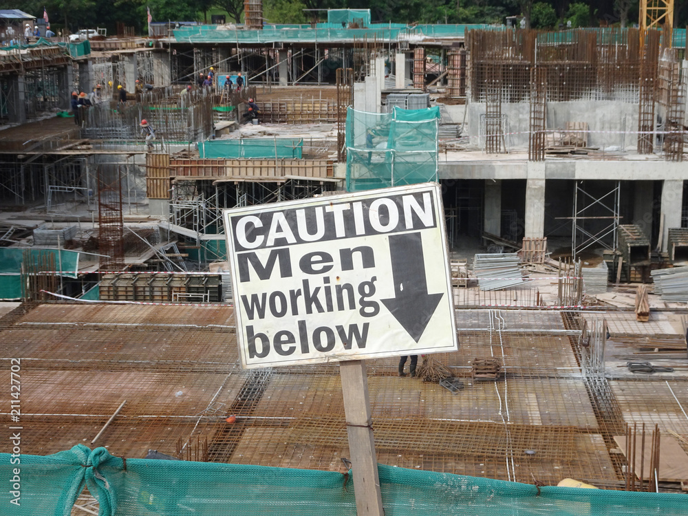 Stock-Foto „Safety signage "CAUTION - Men Working Below" at the ...