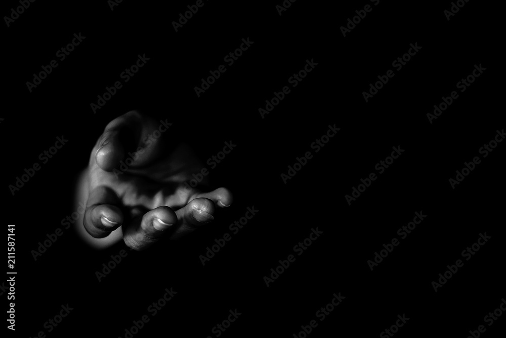 Hand Reaching Out Of Darkness