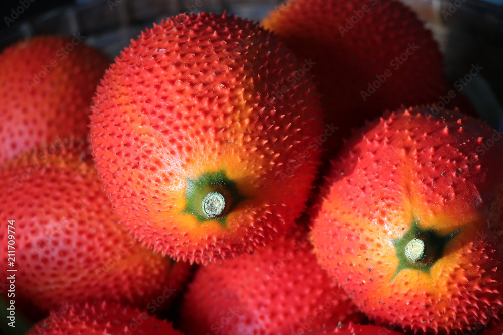 Baby jackfruit orange color with spike herbal fruit in the basket at ...