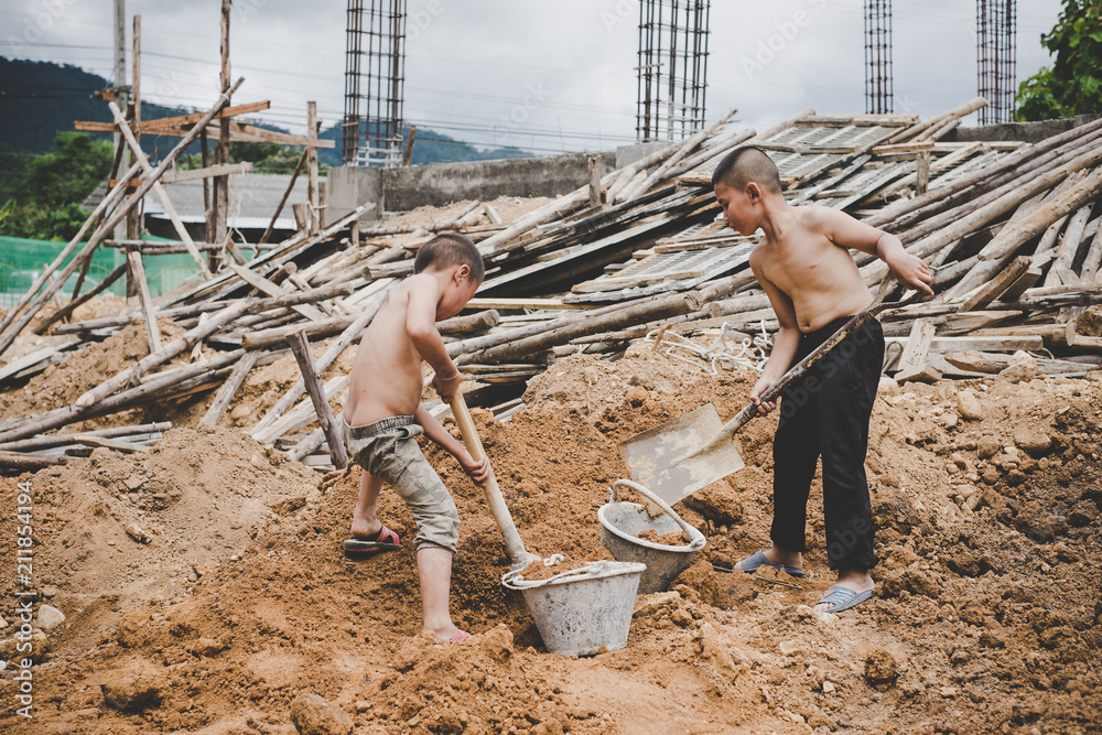 Little boys labor working in commercial building structure, World Day ...