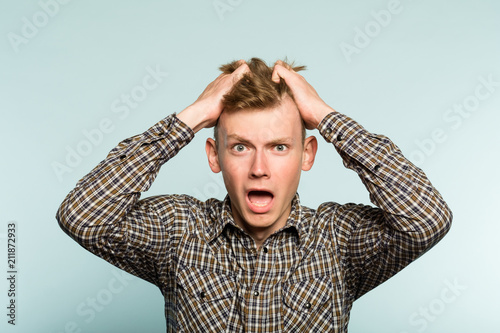 Stockfoto worried shocked distraught disappointed man pulling hair out ...