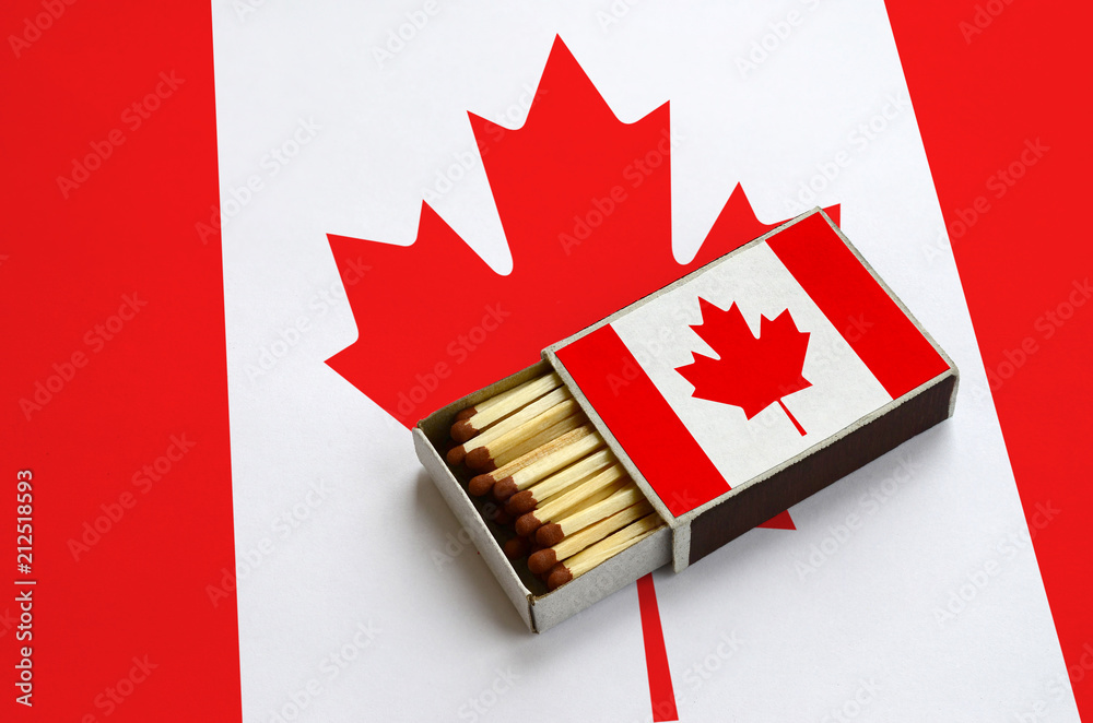 Canada flag is shown in an open matchbox, which is filled with matches ...