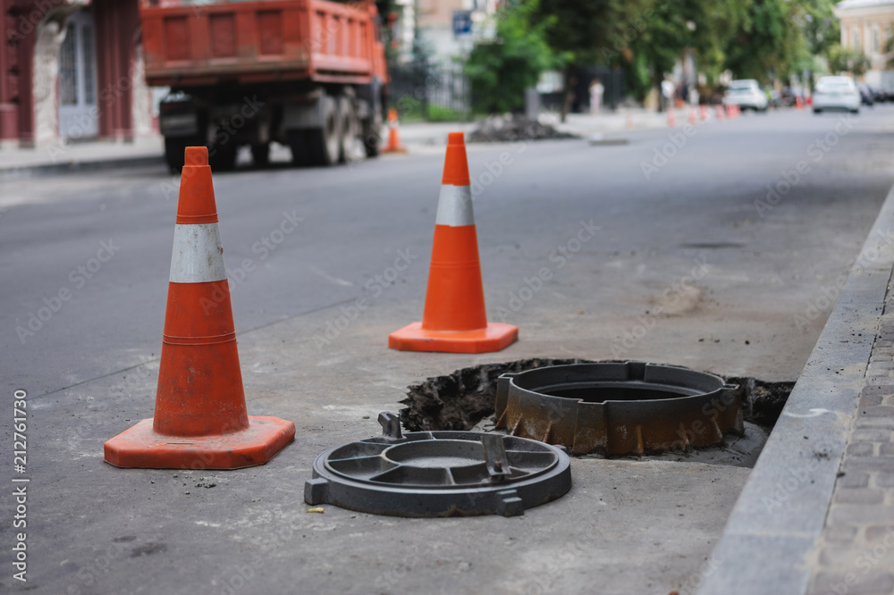 manhole cover replacement, sewer system repair, sewerage; roadworks ...
