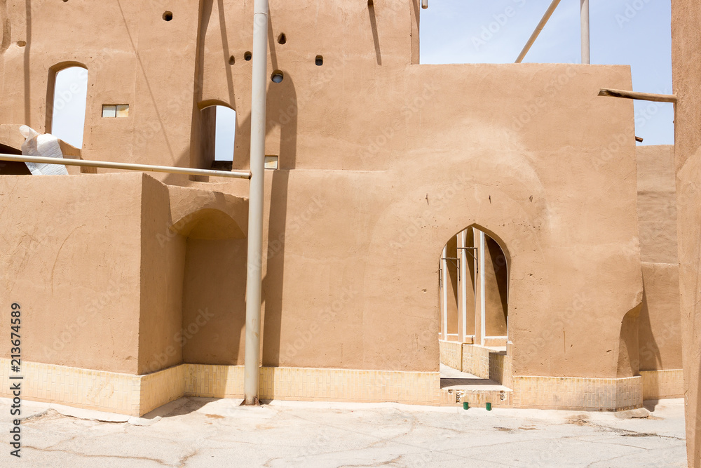Beautiful authentic carved arc in the house wall. Streets of old town ...