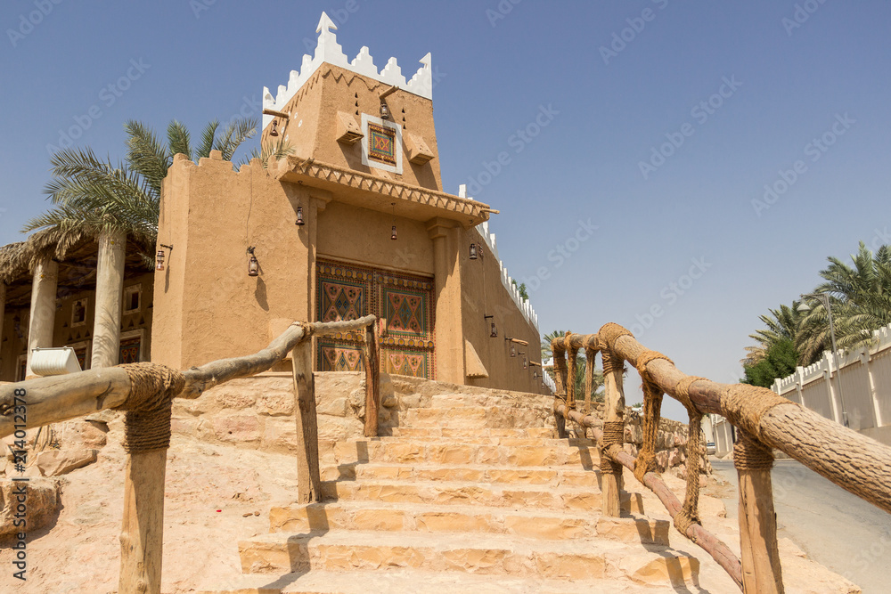 Authentic Arabian style house or a tavern with wooden carved door and ...