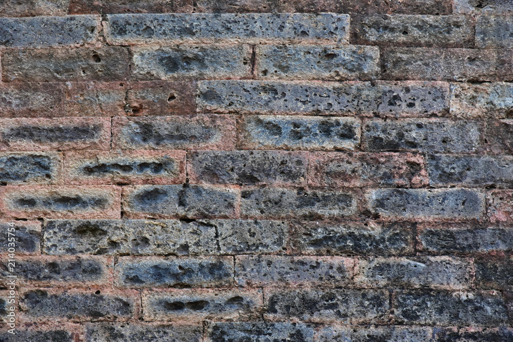 Dark brick wall. Original design background. Brickwork without cement ...