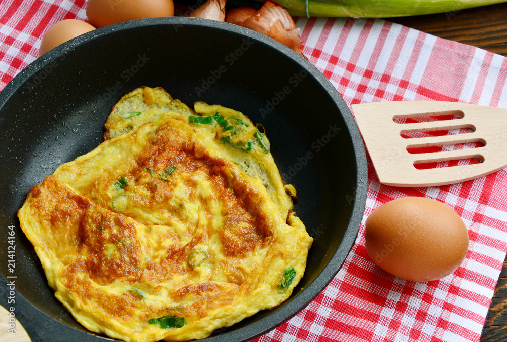 Scallion or Spring onions omelet Thai style in wok (Thai name is Kai ...