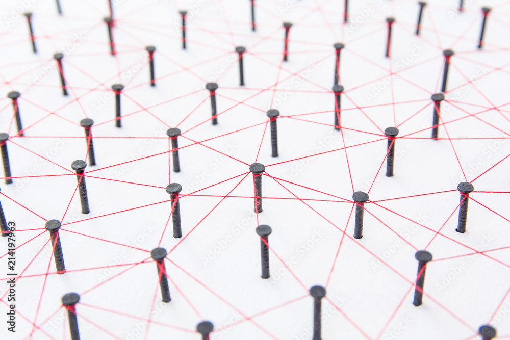 Connecting networks concept - network connected with yarn red on white ...