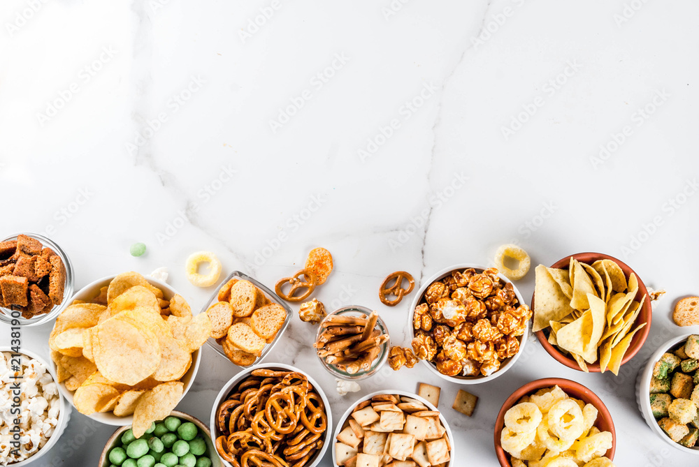 Variation different unhealthy snacks crackers, sweet salted popcorn ...
