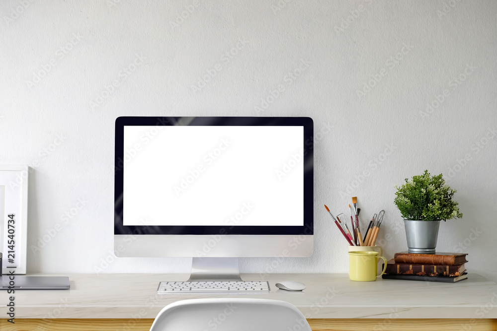 Office workplace with modern desktop computer showing blank screen on ...