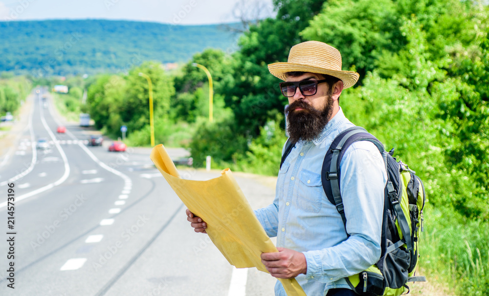 Carry good map. Tourist backpacker looks at map choosing travel ...