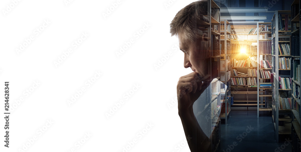 Silhouette of a thinking man on the library hall background with books ...