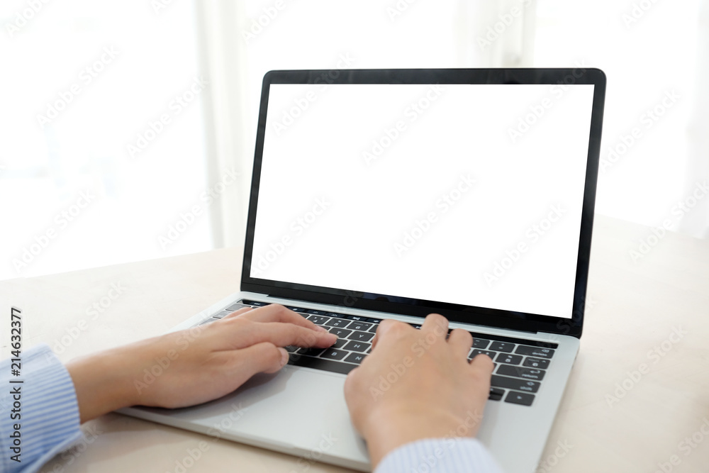 Woman hands using laptop computer with blank screen for mock up ...