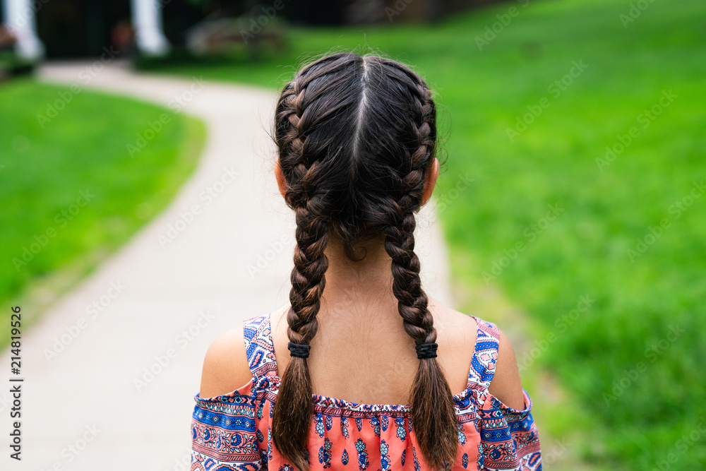 Back view of girl with braids Stock Photo | Adobe Stock