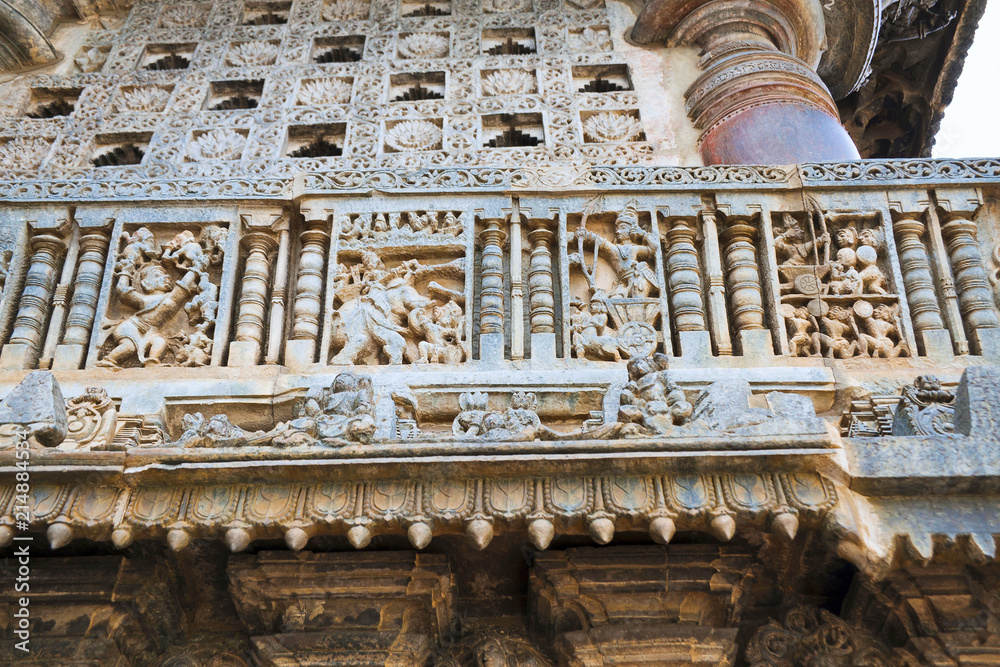 Ornate perforated window and Decorative friezes with scenes from ...
