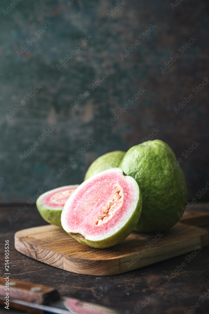 Fresh ripe guava with rustic background Stock Photo | Adobe Stock