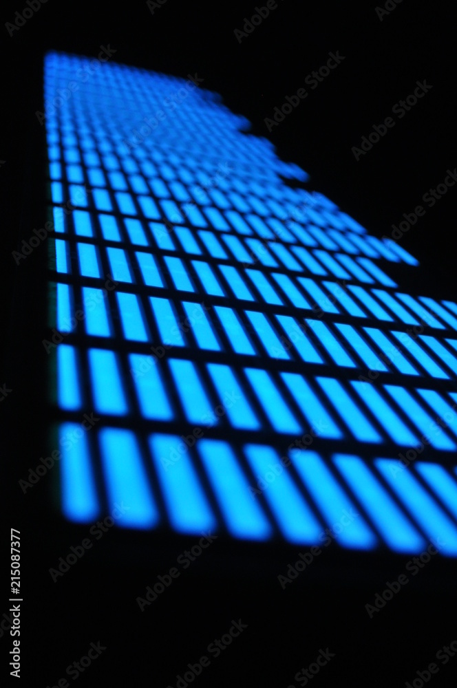 Luminous panel of pixels, with neon blue with green color and an ...