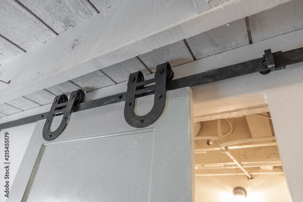 vintage horseshoe sliding barn door hinges Stock Photo | Adobe Stock