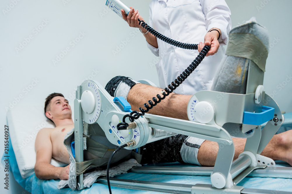 Patient on CPM (continuous passive range of motion) machines. Stock ...
