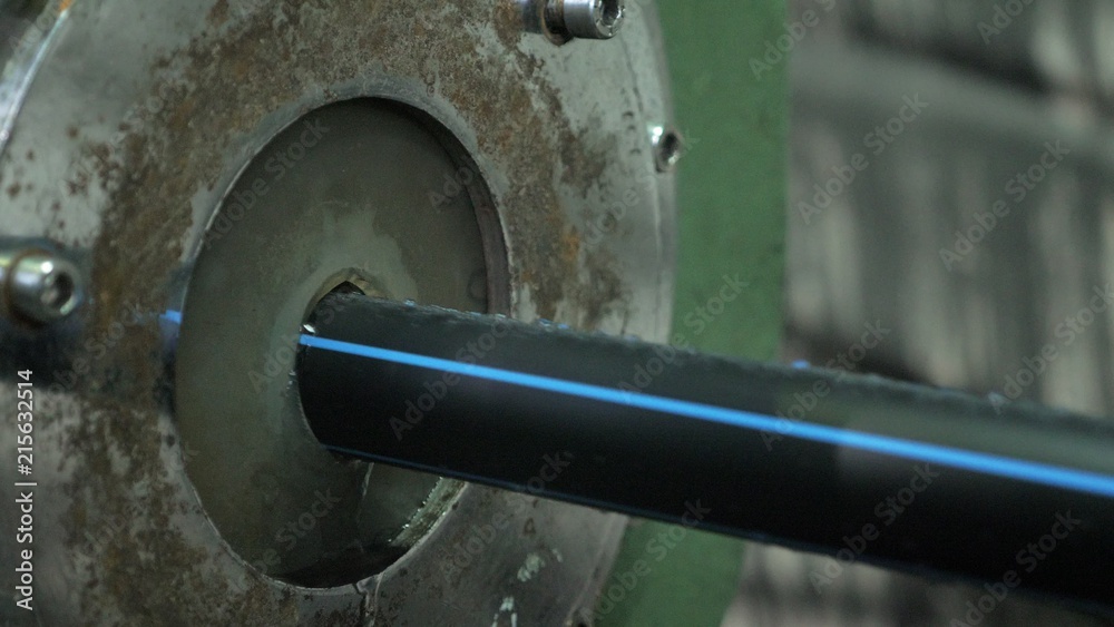 Pipes manufacturing production line. Manufacture of plastic water pipes ...
