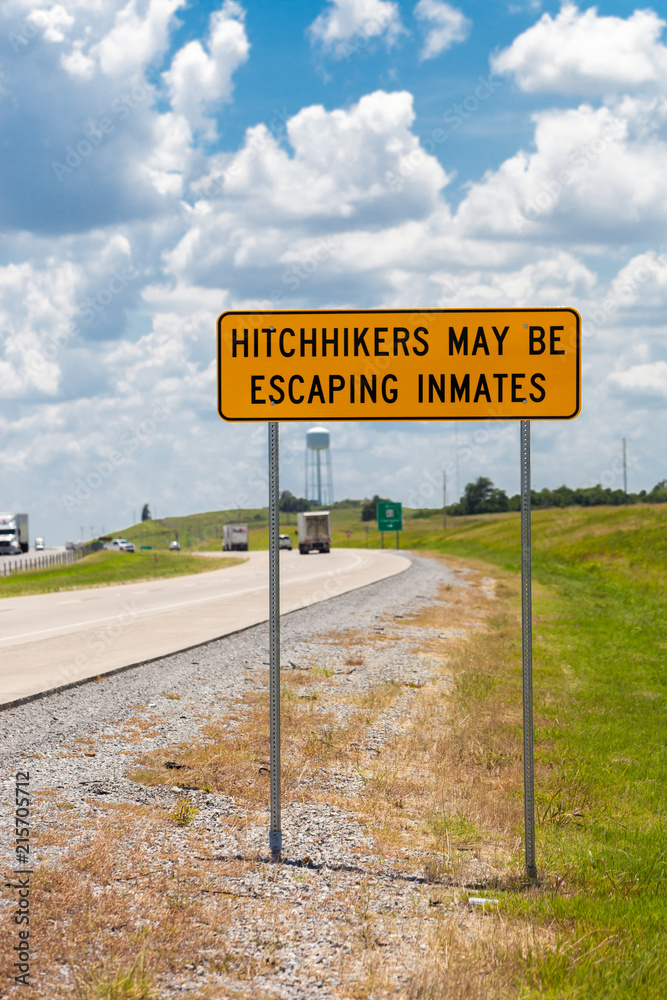 Highway warning sign about hitchhikers that might escaping inmates ...