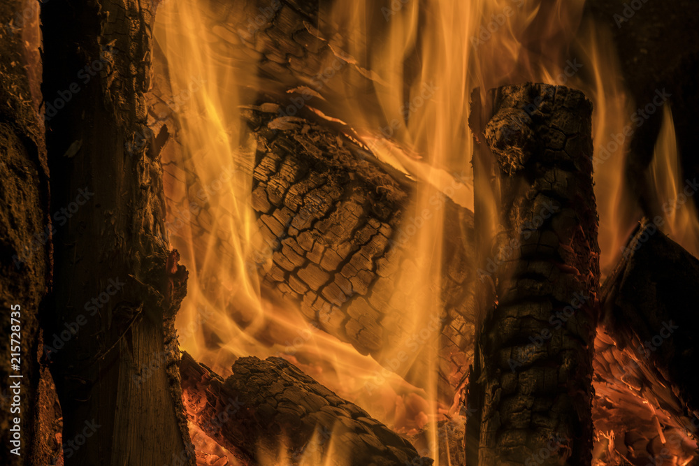 Fire moves across the wood without stop increasing it flames with the ...