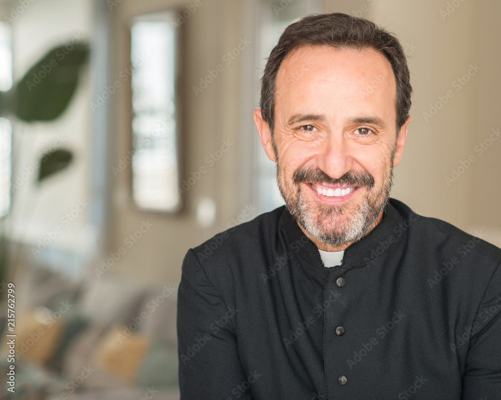 Christian priest man with a happy face standing and smiling with a ...
