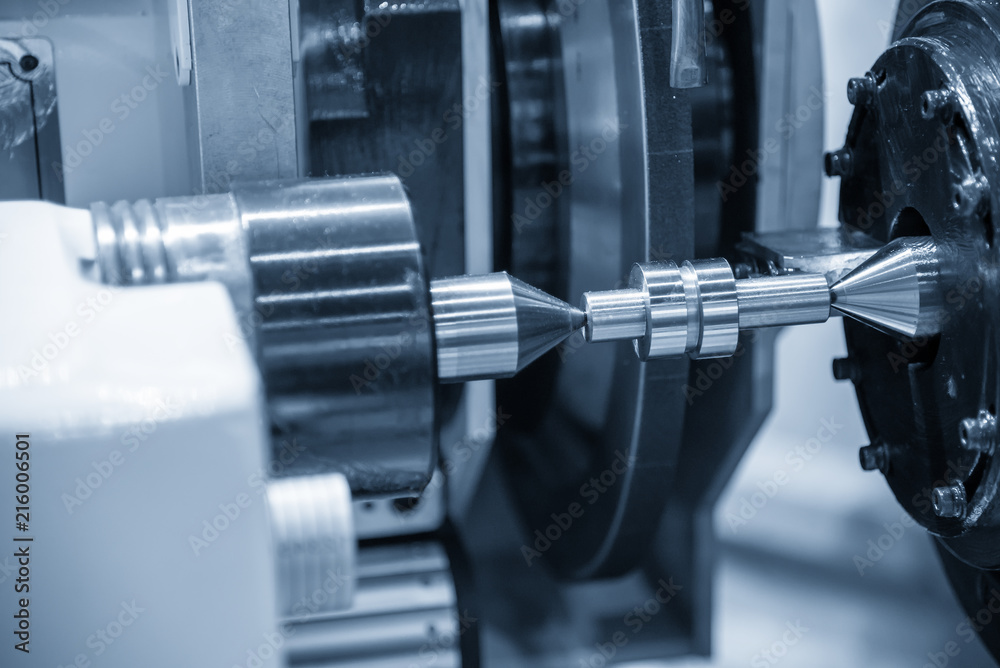 The CNC cylindrical grinding machine making the automotive cam shaft ...