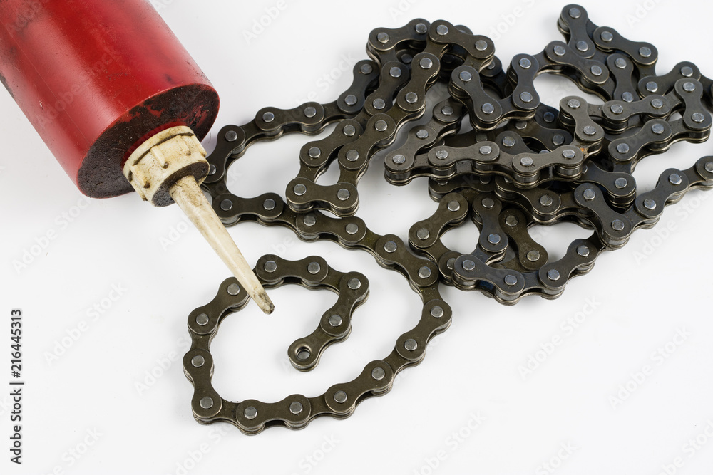 Lubricating the bicycle chain with liquid lubricant. Periodic servicing ...