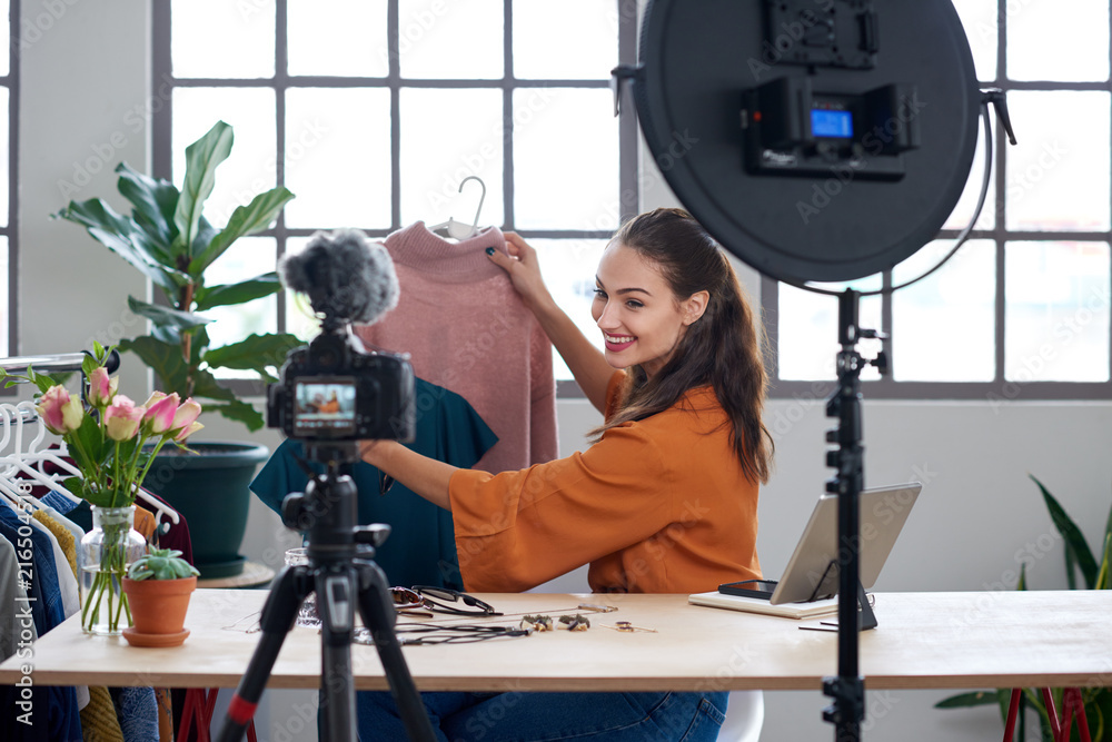 Fashion influencer vlogger creating videos for her channel Stock Photo ...