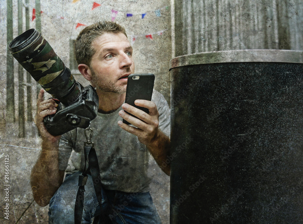 lifestyle funny portrait of young paparazzi photographer man in action ...