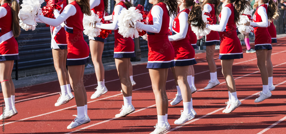 High school cheerleaders cheering during football game Stock Photo ...