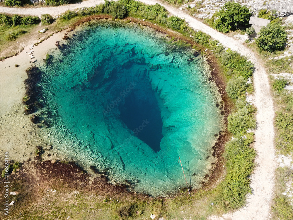 The spring of the Cetina River (izvor Cetine) in the foothills of the ...