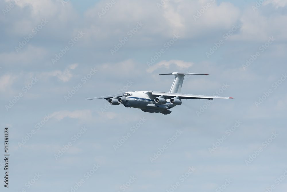 Four-engine heavy cargo plane in the sky. The plane to extinguish fires ...