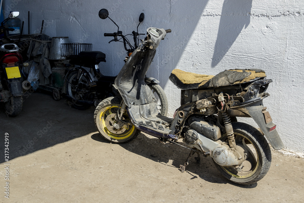 old amandoned broken motorcycle scooter Stock Photo | Adobe Stock