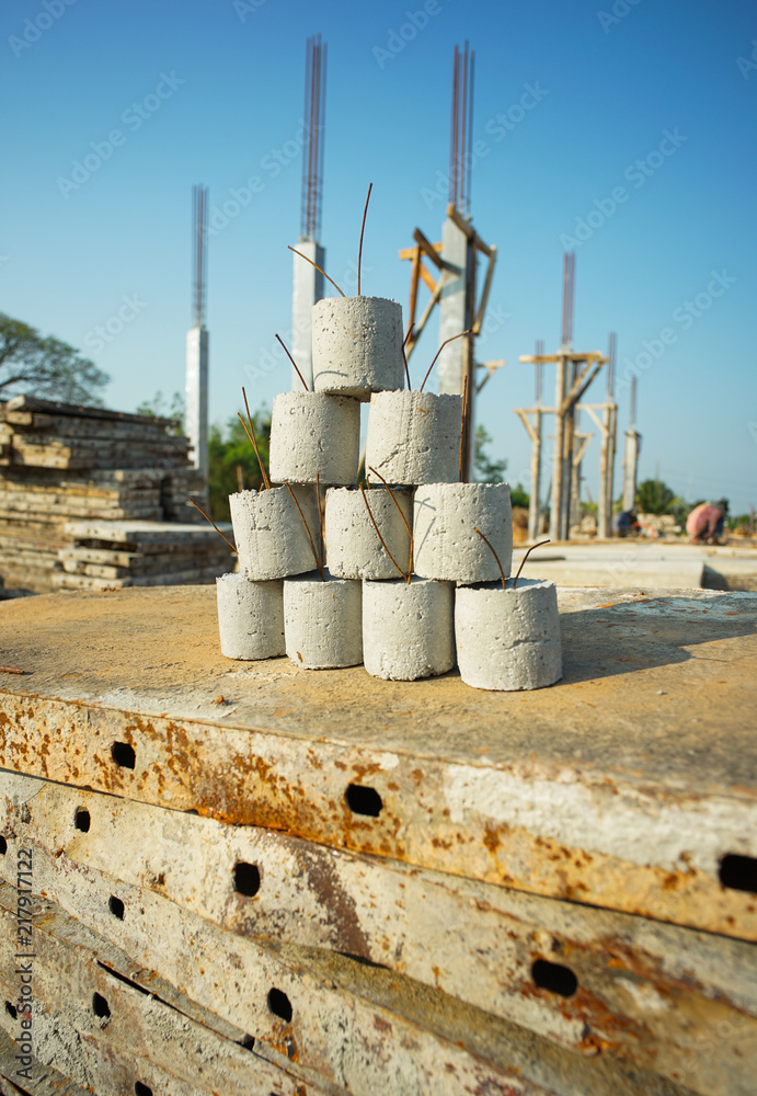 Cement lumps with wire for providing the space between wire mesh and ...