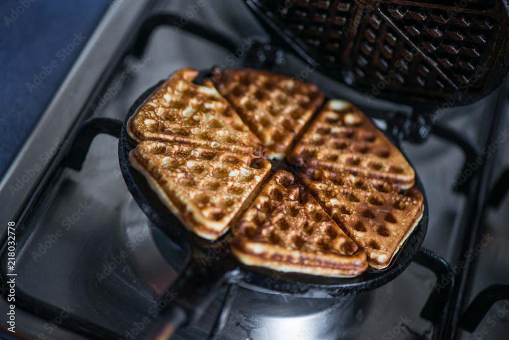 Just cooked, delicious, tasty, hot yogurt pancakes on waffle iron on ...