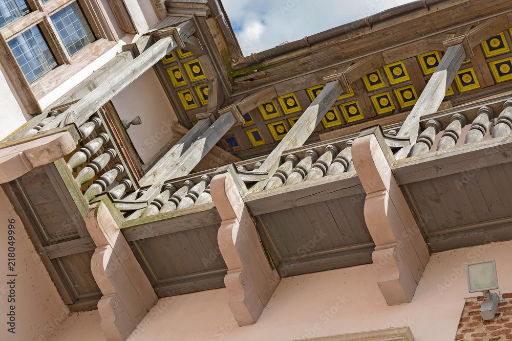 View from the bottom up at Mir Castle. An old balcony, a beautiful ...