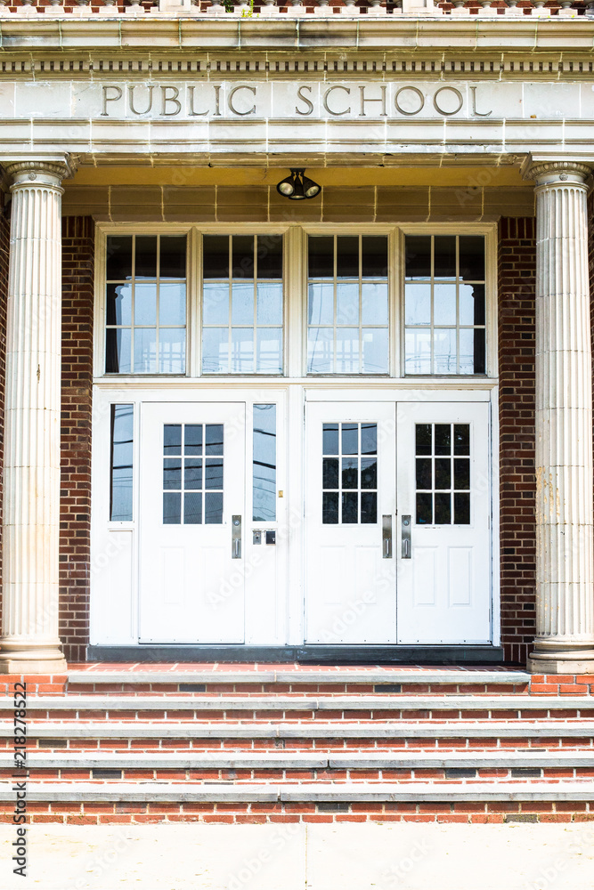 Entrance doors to a typical American school building with steps seen ...