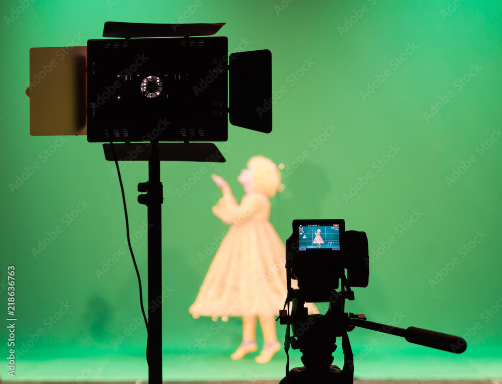 Actress in yellow dress starred in a movie on a green background. Key ...
