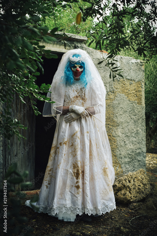 scary evil clown in a bride dress outdoors Stock Photo | Adobe Stock
