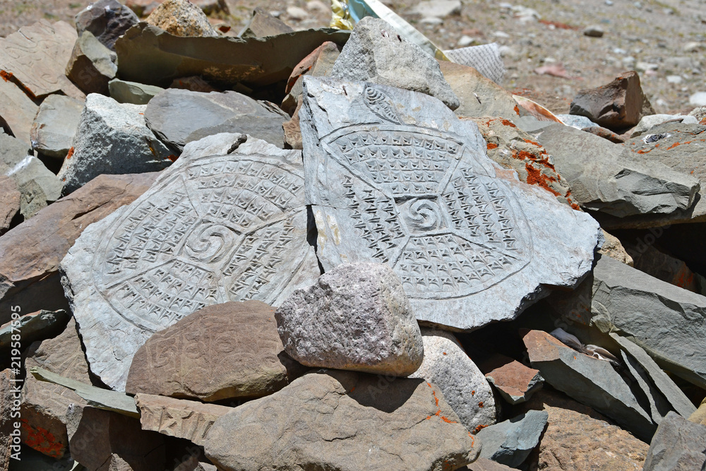 Tibet. Buddhist prayer stones with mantras and ritual drawings on the ...