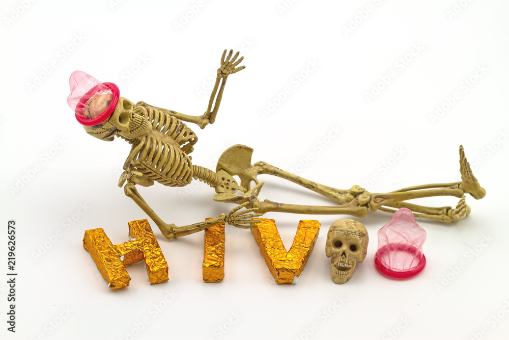 Still life concept human body bone wear condoms and A word HIV on white ...