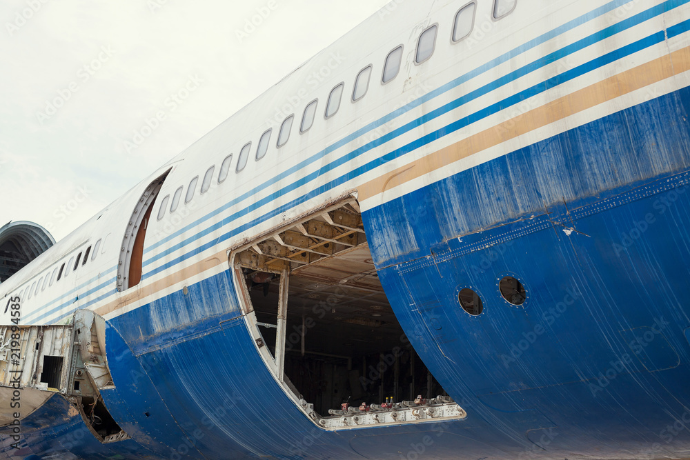 Old decommissioned airplanes and airplane details in a scrap metal yard ...