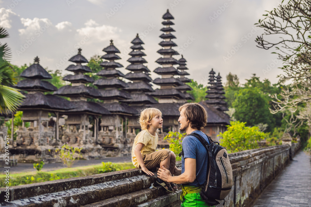 Dad and son tourists in Traditional balinese hindu Temple Taman Ayun in ...