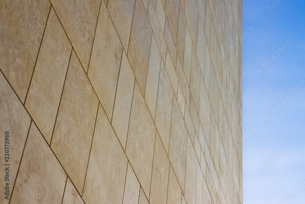 New modern ventilated stone wall made with different blocks of ...