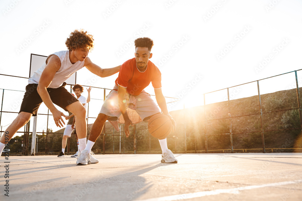 Group of young strong multiethnic men basketball players Stock Photo ...