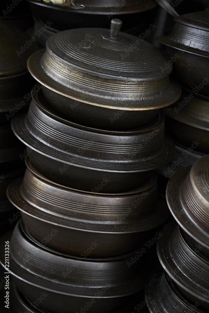 Pile of cooking pots Stock Photo | Adobe Stock