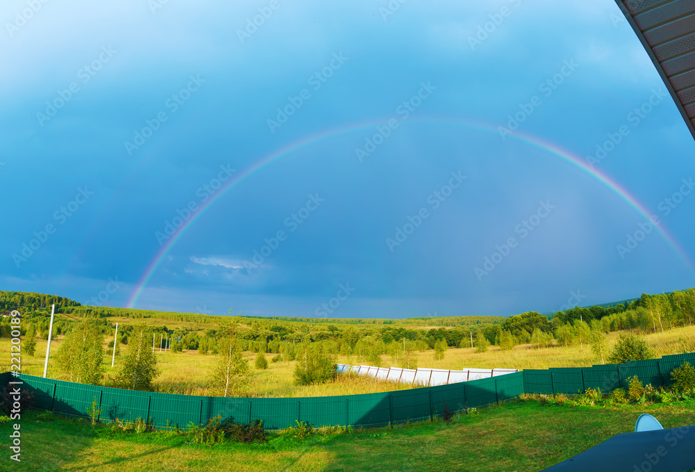 Beautiful nature landscape with double full rainbow above field ...